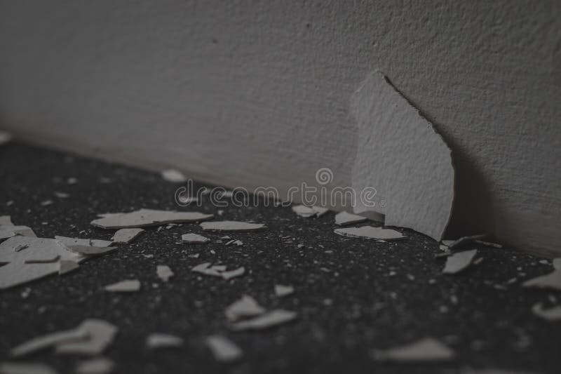 Chipped Parts of Wall or Plaster Sitting on the Ground. Texture of ...