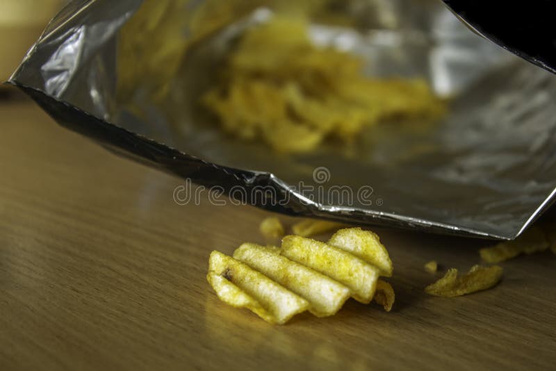 Chips Crisps Pack, Smoke, Wooden Table, Yellow, Ribbed. Stock Image ...