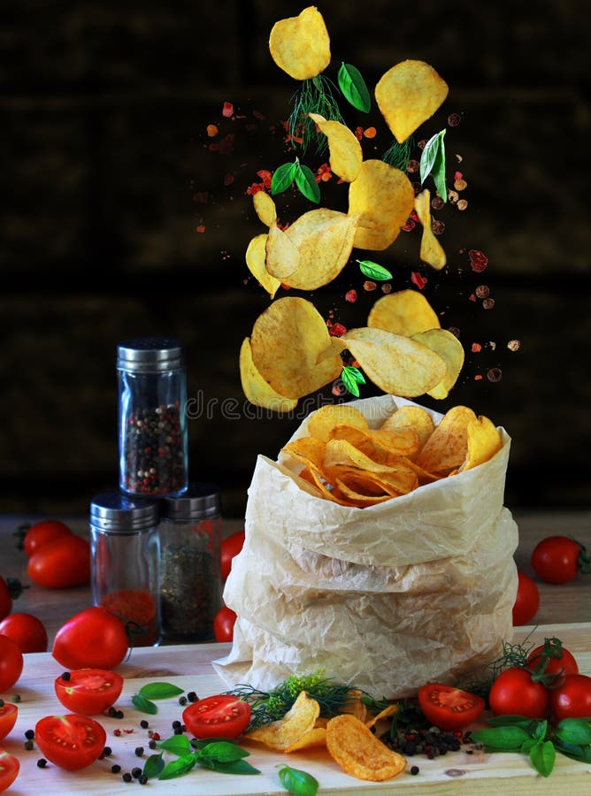 Chips Fall into a Paper Bag Stock Image - Image of basil, calories ...