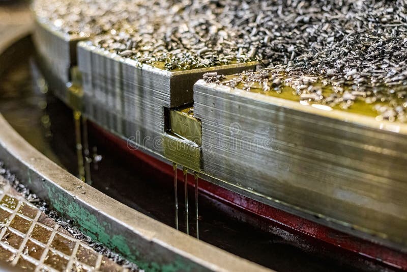 Chips and Oil Drain into the Sump after Tooth Cutting on an Oil-cooled ...