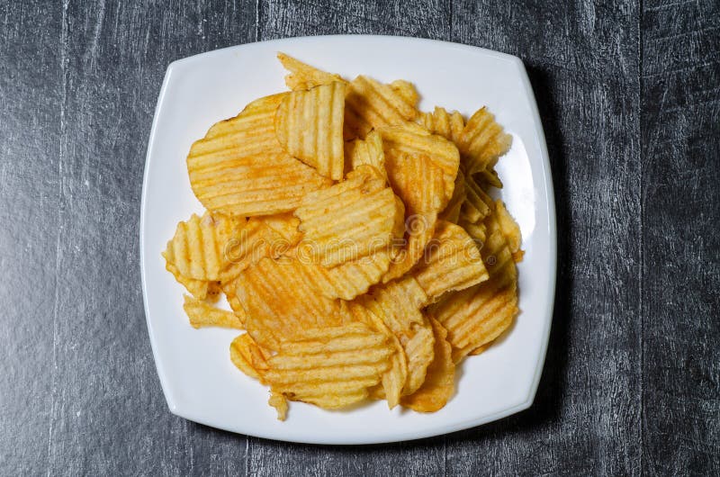 Chips in a plate stock image. Image of chips, potato - 140224187