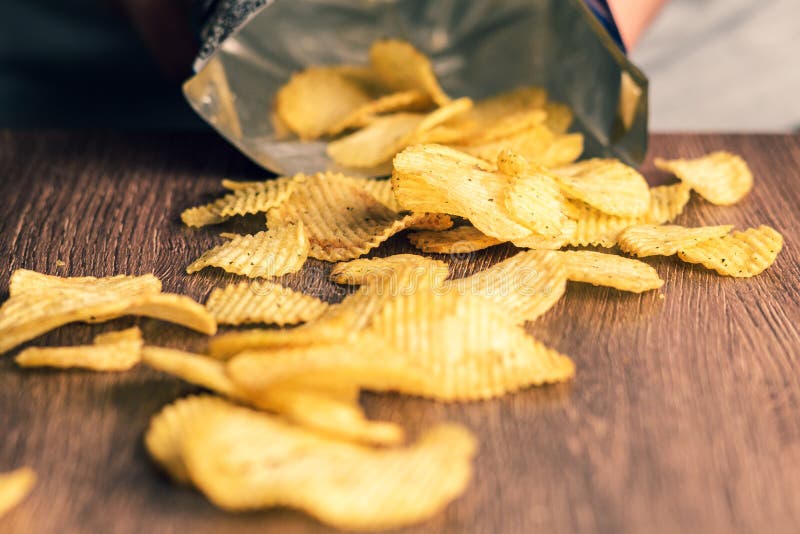 Chips Scattered on the Table Stock Photo - Image of food, fried: 266430950