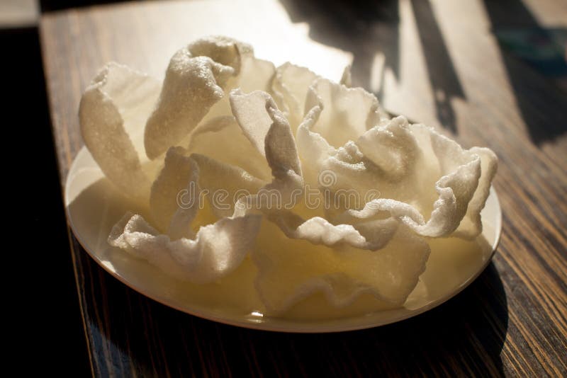 Chips from White Rice. Crispy Rice Cracker on a White Plate, on a ...