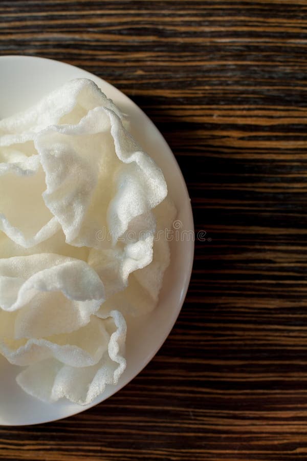 Chips from White Rice. Crispy Rice Cracker on a White Plate, on a ...