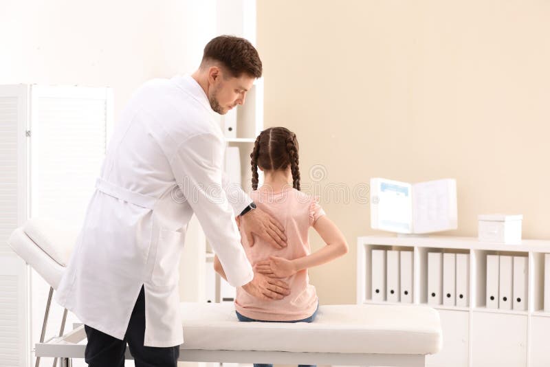 Chiropractor Examining Child with Back Pain Stock Image - Image of ache ...