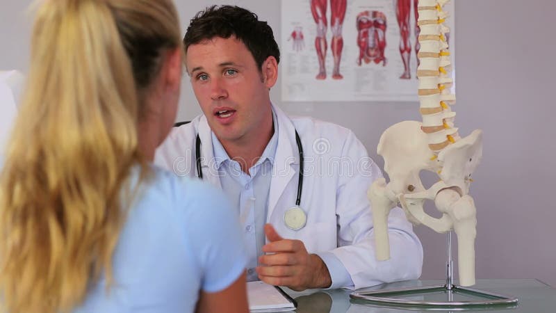 Chiropractor Speaking with His Patient Stock Footage - Video of ...