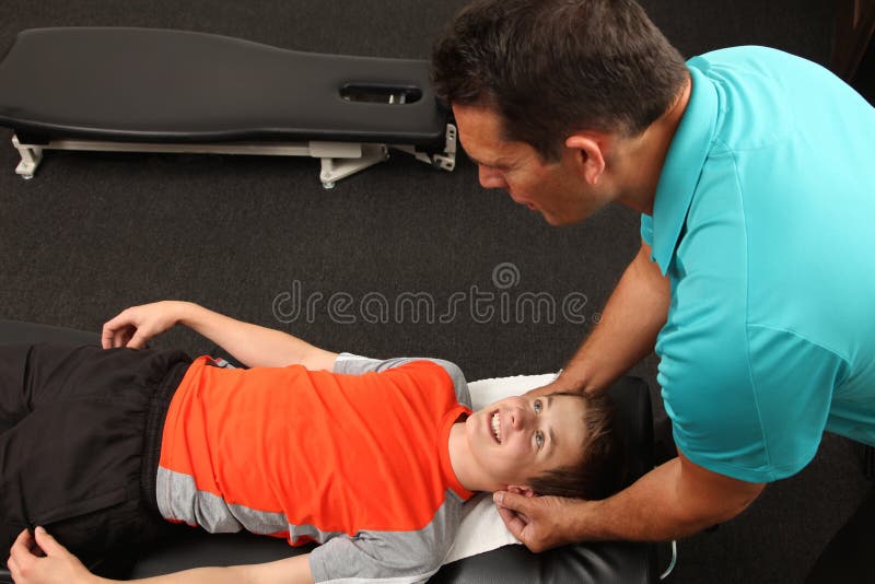 Handsome Chiropractor Working Stock Image - Image of examination ...