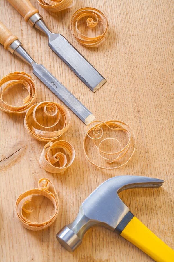 Chisel and Claw Hammer with Wooden Shavings on Board Stock Photo ...
