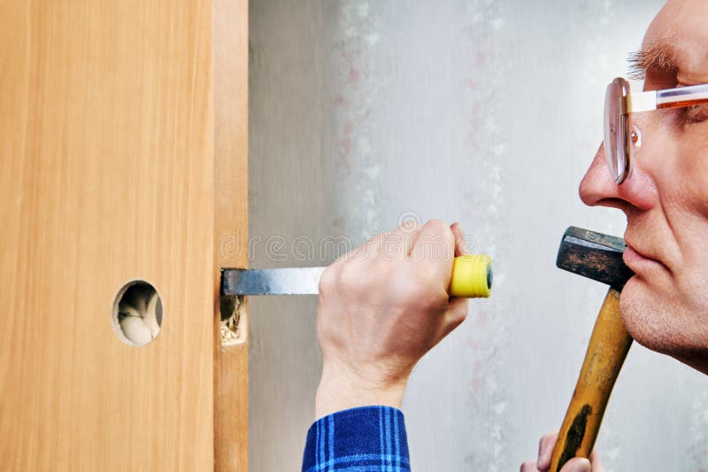Chisel Driven by Hammer, Cuts into Wooden Door Frame To Create Mortise ...