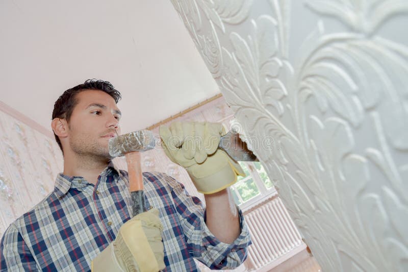 Chiseling at old wall stock image. Image of glove, person - 103741281