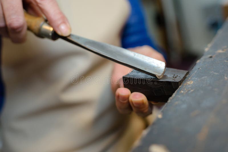 Chiseling in the workshop stock image. Image of chipping - 338943473