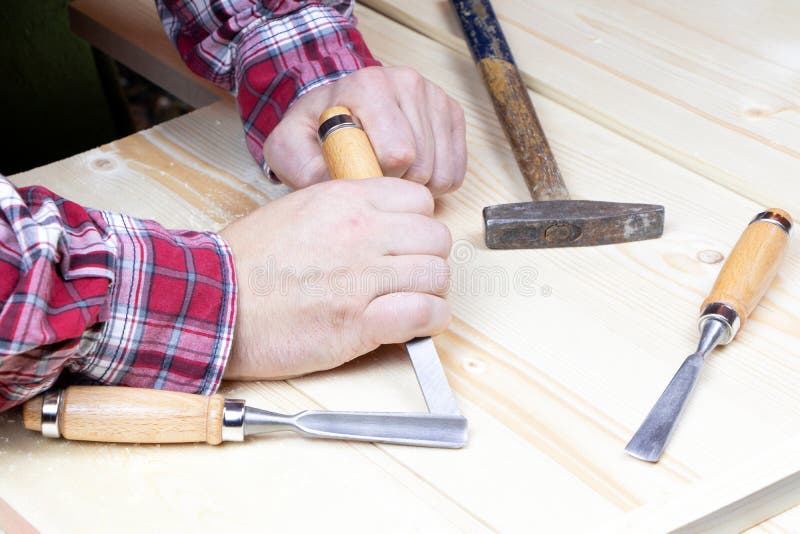 Handyman Chisels Wood Along the Lip for the Plate Latch To Slot into ...