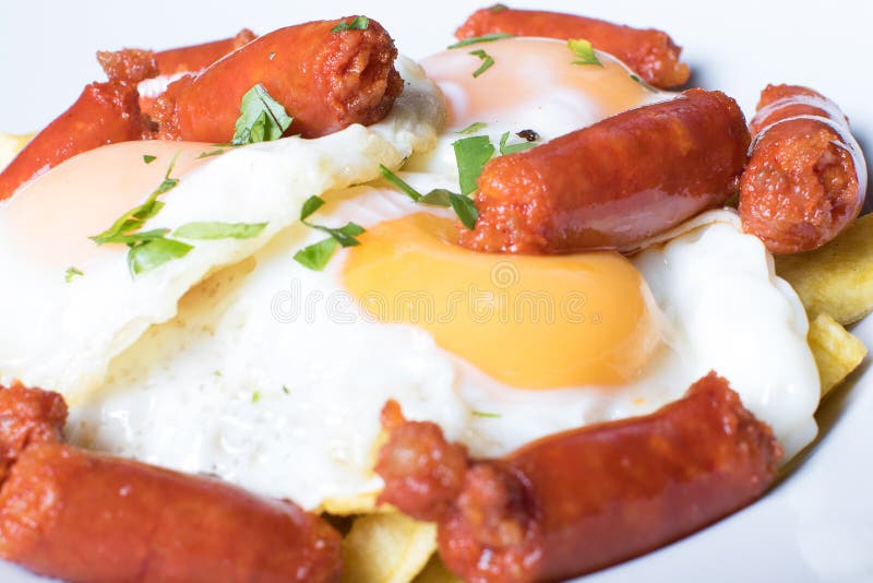 Chistorra Dish with Egg, Potatoes and Iberian Ham Stock Photo - Image ...