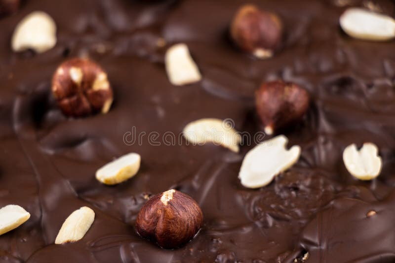 Chocolate Background with Peanuts and Hazelnuts Close-up, Side View ...