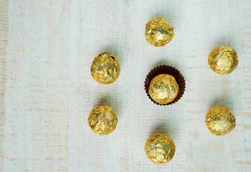 Chocolate Ball Wrapped in Foil, Chocolate Background Stock Photo ...