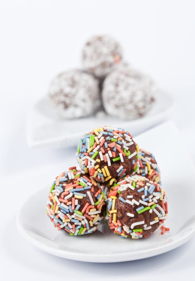 Chocolate Balls with Colorful Toppings on White Stock Photo - Image of ...