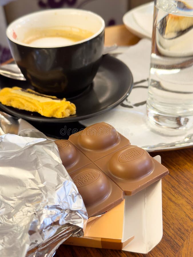 Chocolate Bar and Cappuccino with Pastry on Wooden Table Editorial ...