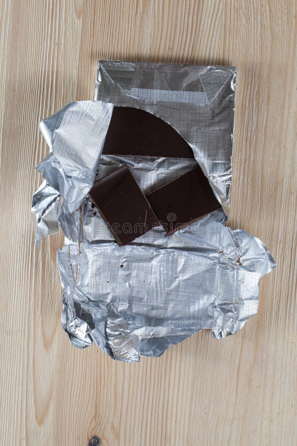 A Chocolate Bar Open from Foil on a White Table Stock Photo - Image of ...