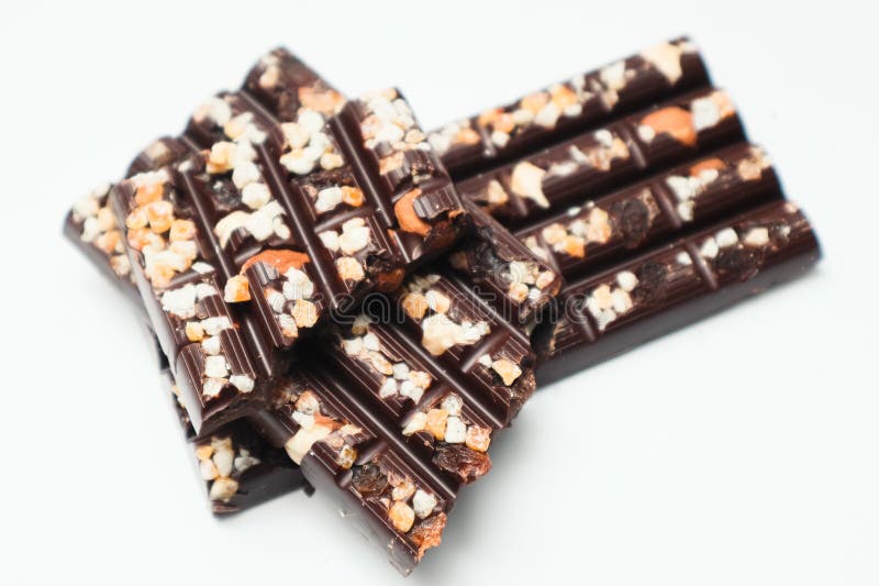 Chocolate Bar Pieces with Nuts on White Background. Selective Focus ...