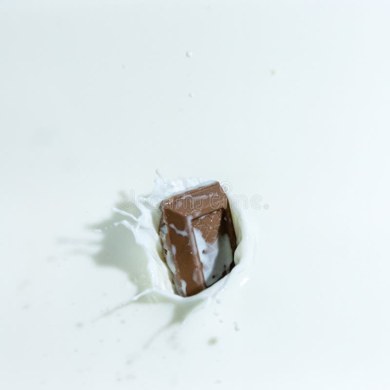 Chocolate Bars Falling into Milk with Splashes Stock Image - Image of ...