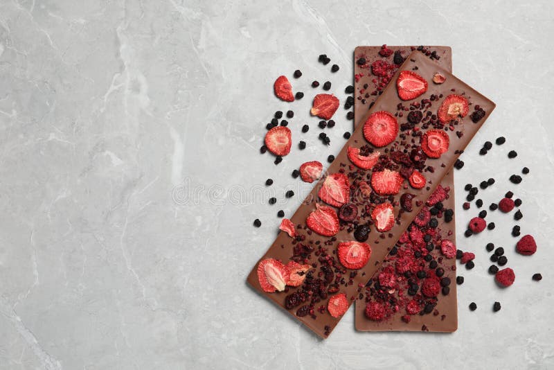 Chocolate Bars with Freeze Dried Berries on Grey Marble Table, Flat Lay ...