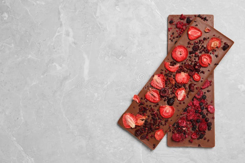 Chocolate Bars with Freeze Dried Berries on Grey Marble Table, Top View ...