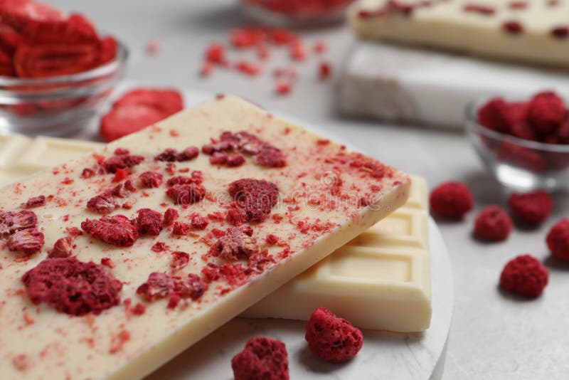 Chocolate Bars with Freeze Dried Raspberries on Light Marble Table ...