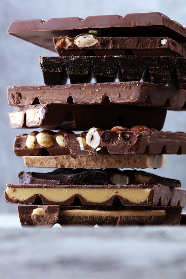 Chocolate Bars on Table with Chocolate Tower. Stock Photo - Image of ...