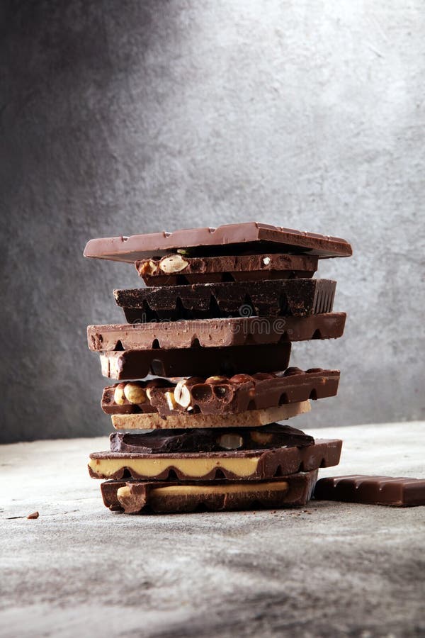 Chocolate Bars on Table with Chocolate Tower. Stock Photo - Image of ...