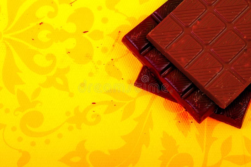 Chocolate Bars on Yellow Background Stock Photo - Image of brown ...