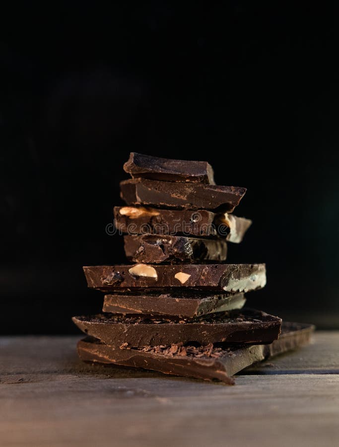 Chocolate Blocks on a Wooden Table on a Brown Background Stock Image ...