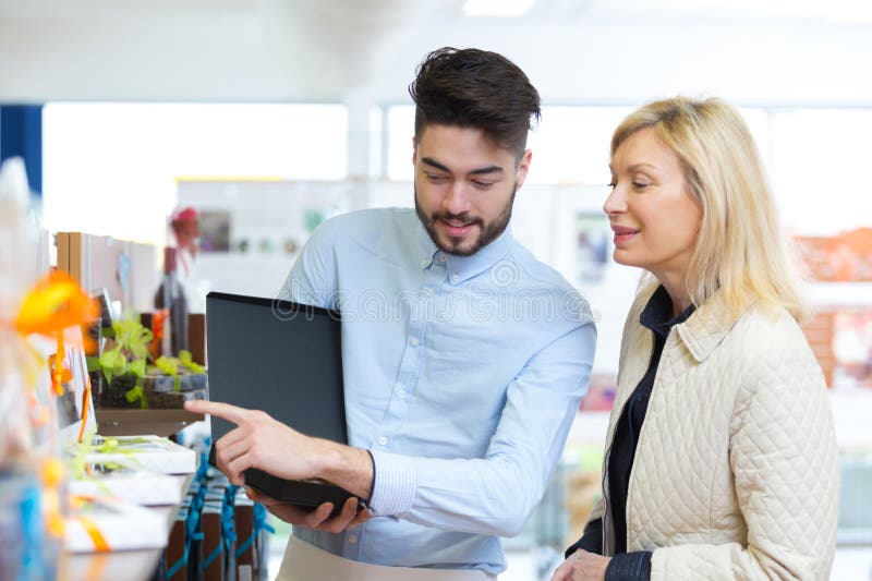 Chocolate Boutique Merchandiser Assisting Client Stock Photo - Image of ...