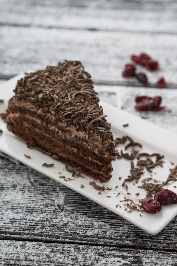 Chocolate Brown Cake and Slice on Table Stock Photo - Image of plate ...