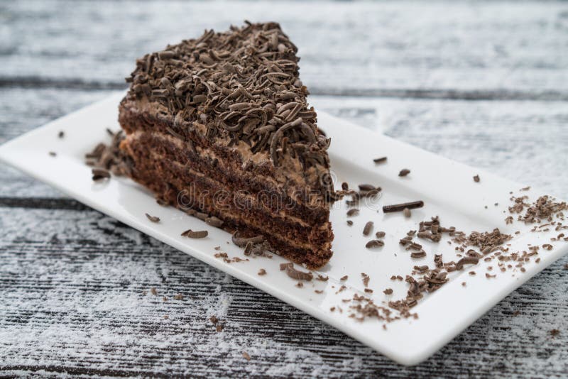 Chocolate Brown Cake and Slice on Table Stock Image - Image of cake ...