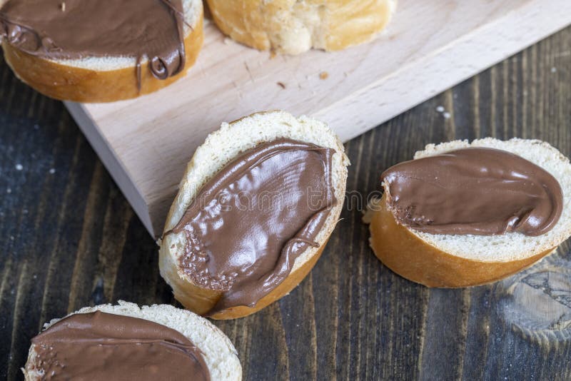 Chocolate Butter Spread on Bread while Cooking Breakfast Stock Image ...