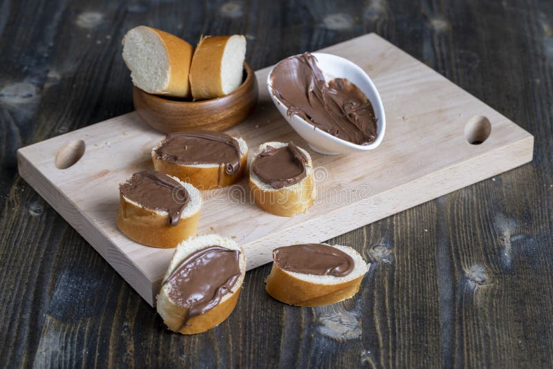 Chocolate Butter Spread on Bread while Cooking Breakfast Stock Image ...