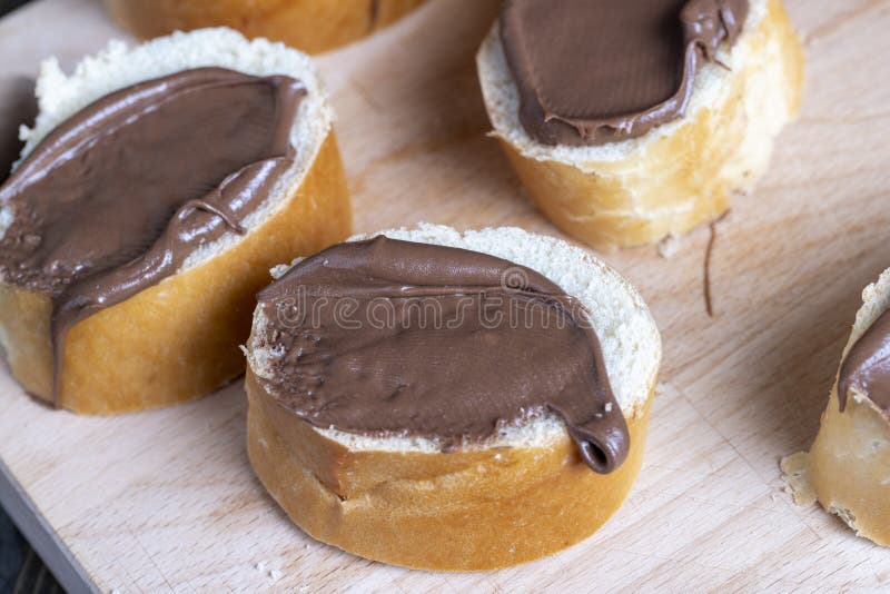 Chocolate Butter Spread on Bread while Cooking Breakfast Stock Photo ...