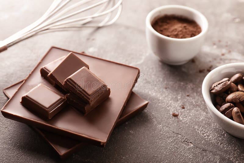 Chocolate with Cacao Powder and Roasted Coffee Beans on Grey Table ...