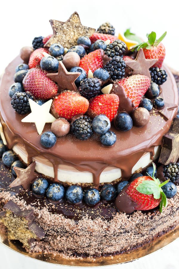 Chocolate Cake with Icing, Decorated with Fresh Fruit Stock Image ...