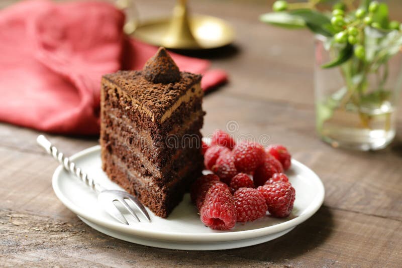 Chocolate cake on a plate stock image. Image of piece - 126885351