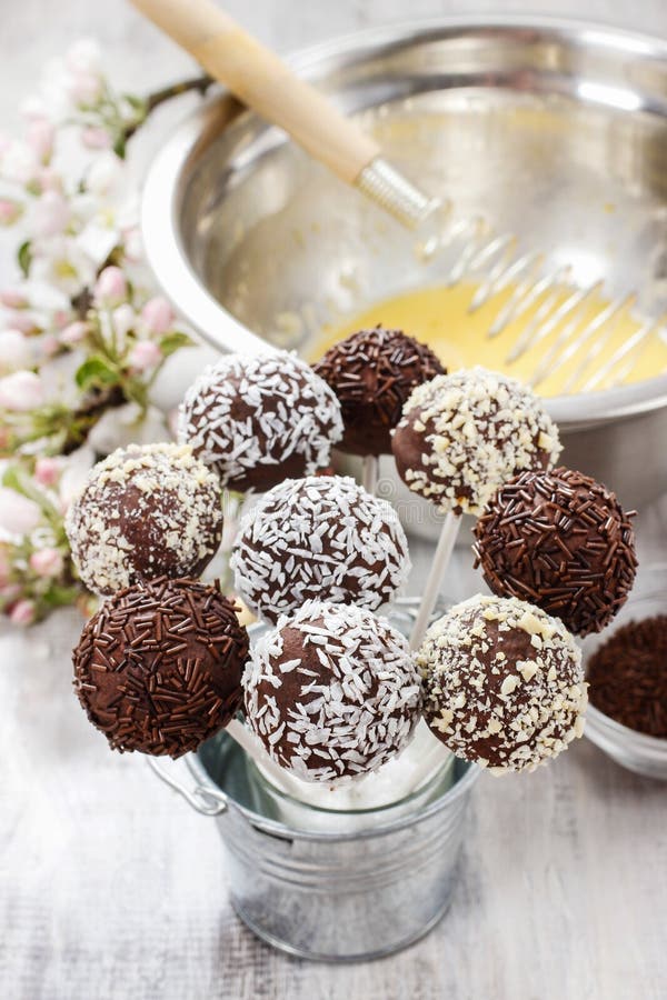 Chocolate Cake Pops on Kitchen Table Stock Photo - Image of flakes ...