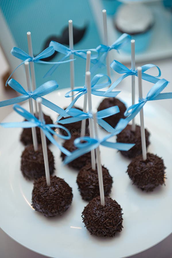 Chocolate Cake Pops on the Plate with Blue Ribbons Stock Photo - Image ...