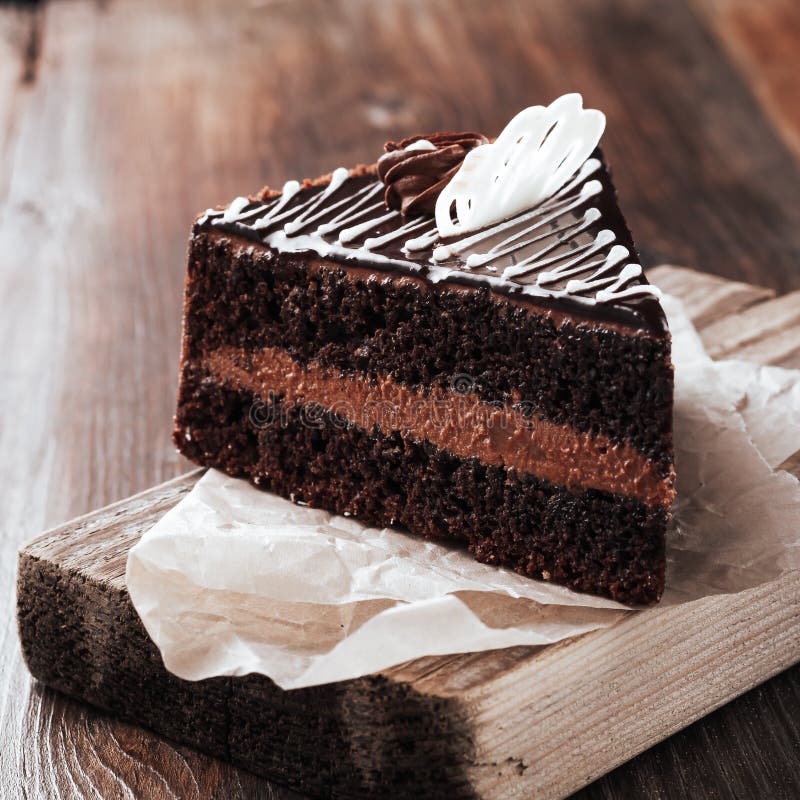 Chocolate Cake Side View on a Cutting Board Rustic Style. Stock Image ...