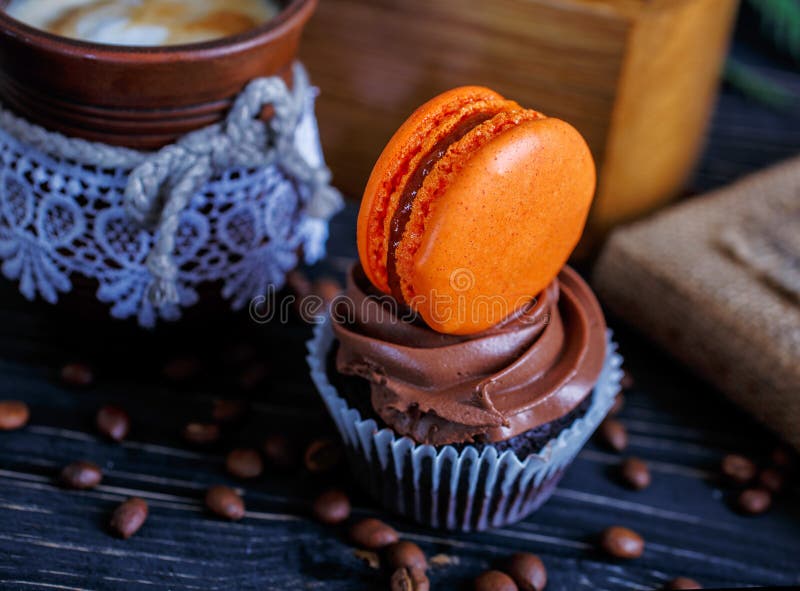Macaroon that is Decorated To Look Like a Strawberry with Another ...