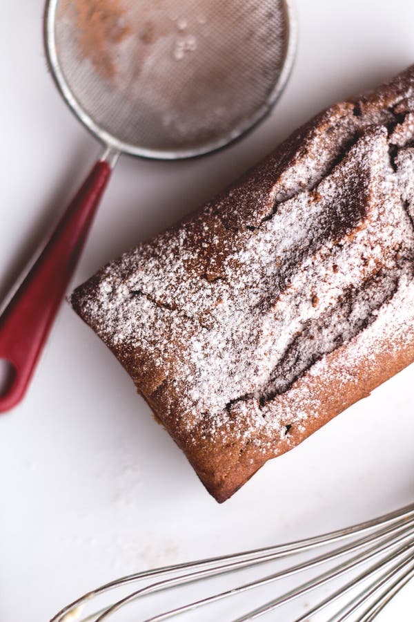 Chocolate Cake, Whisk, Strainer on White Plate Stock Photo - Image of ...