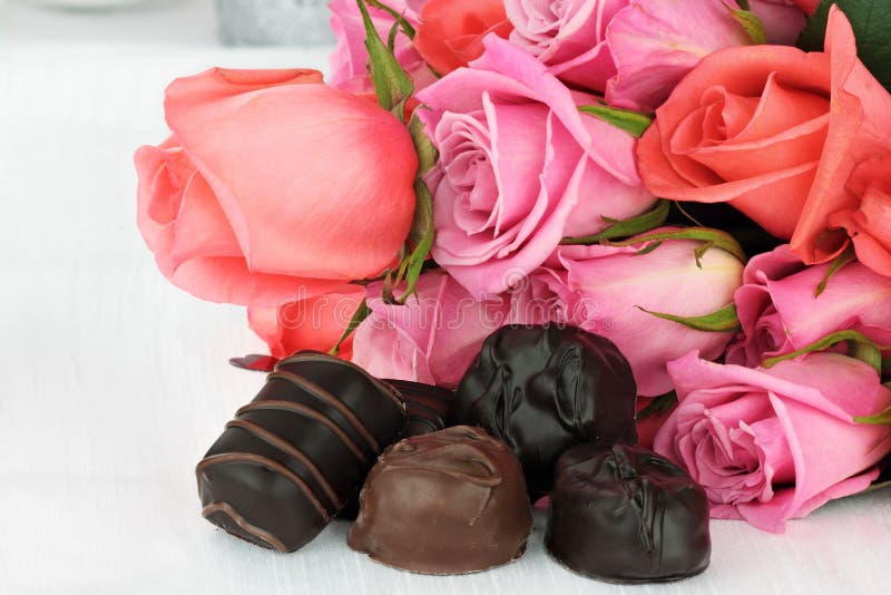 Chocolate Candies and Bouquet of Roses Stock Photo - Image of flowers ...
