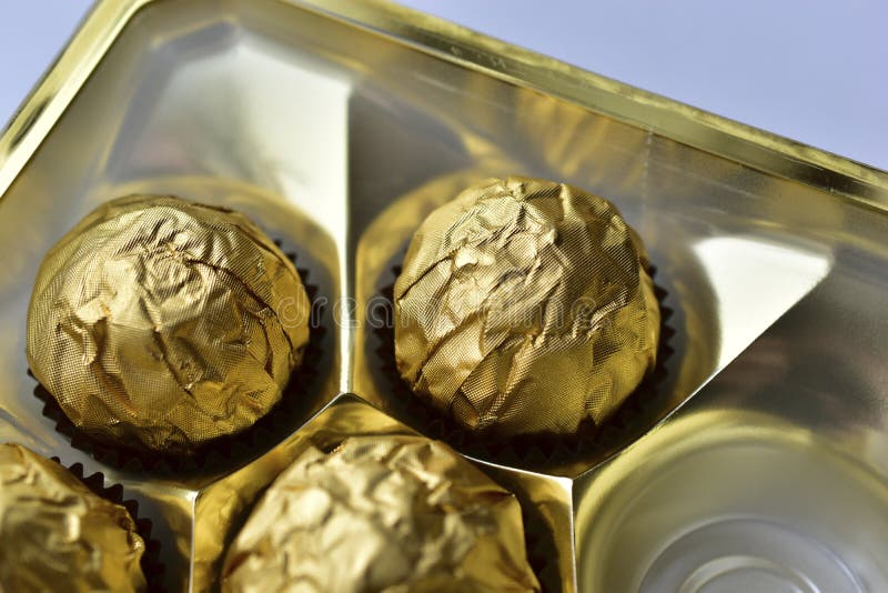 Chocolate Candies in a Box in a Gold Wrapper Stock Photo - Image of ...