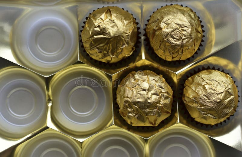 Chocolate Candies in a Box in a Gold Wrapper Stock Image - Image of ...