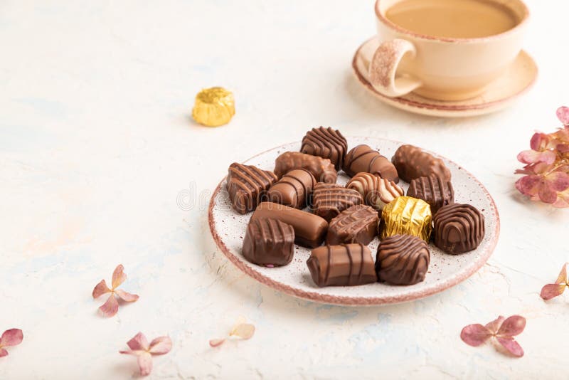 Chocolate Candies with Cup of Coffee. Side View, Close Up Stock Image ...