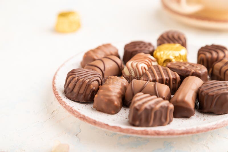 Chocolate Candies with Cup of Coffee. Side View, Selective Focus Stock ...